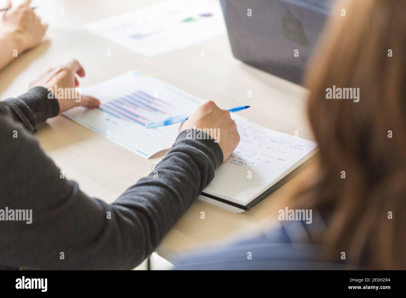 taking notes at team meeting Stock Photo - Alamy