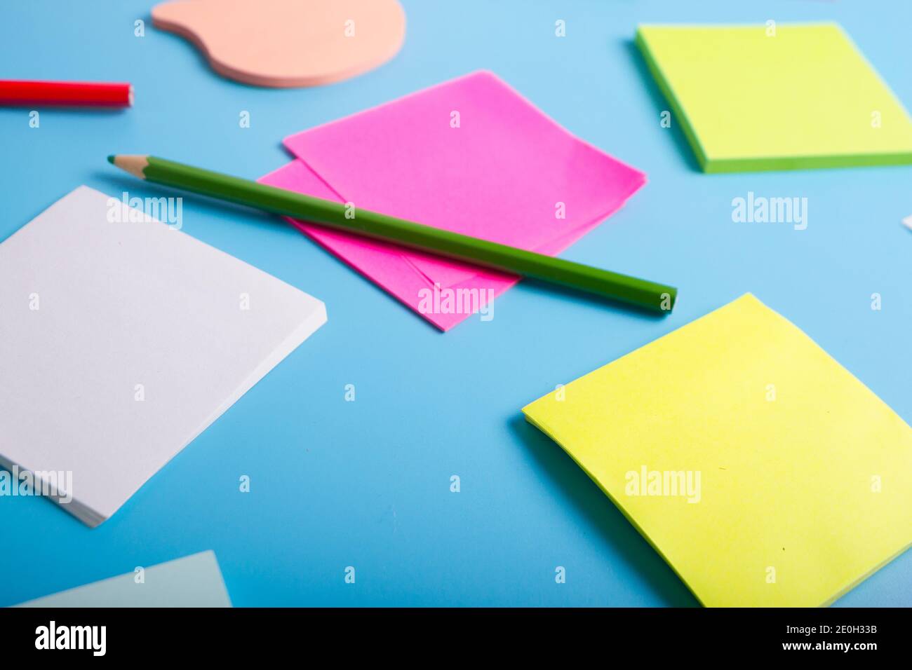 Reminder notes on the bright colorful paper. Blue background Stock ...