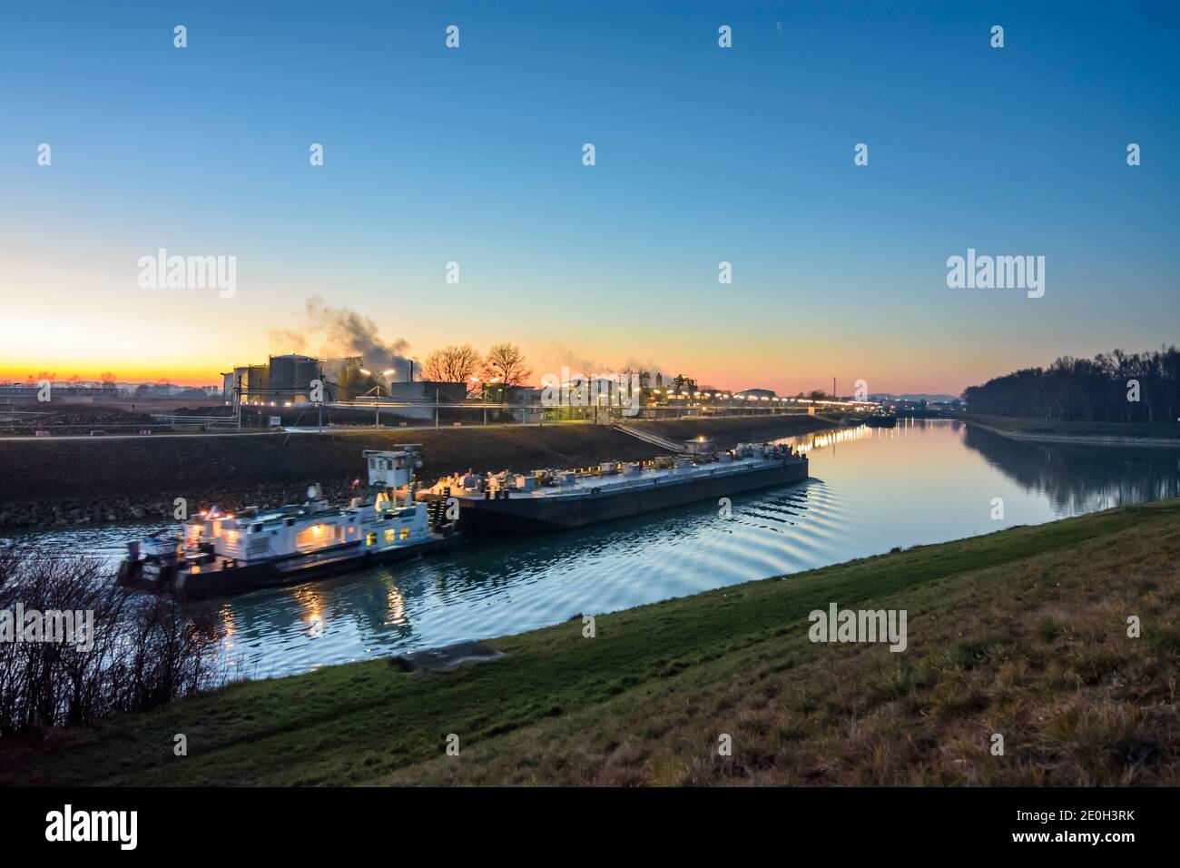 Wien, Vienna: cargo ship entering port Ölhafen Lobau, tank farm in 22 ...
