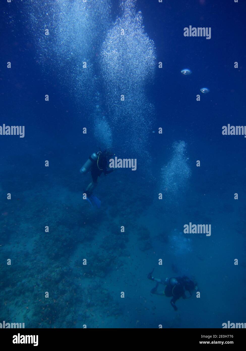 two divers make many bubbles during dive Stock Photo - Alamy