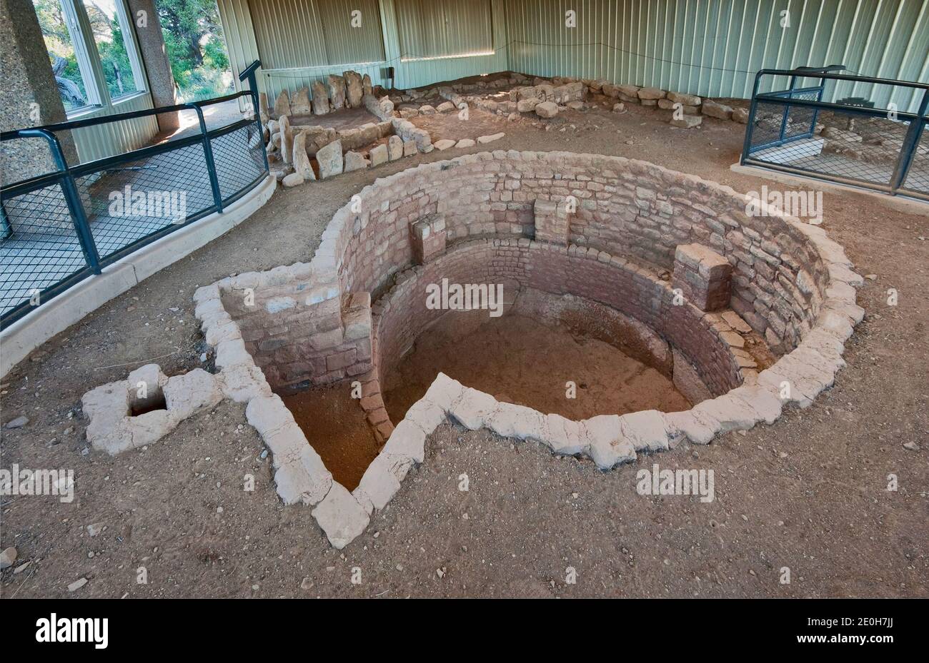 Kiva (ceremonial chamber) with megaliths in background at Megalithic ...
