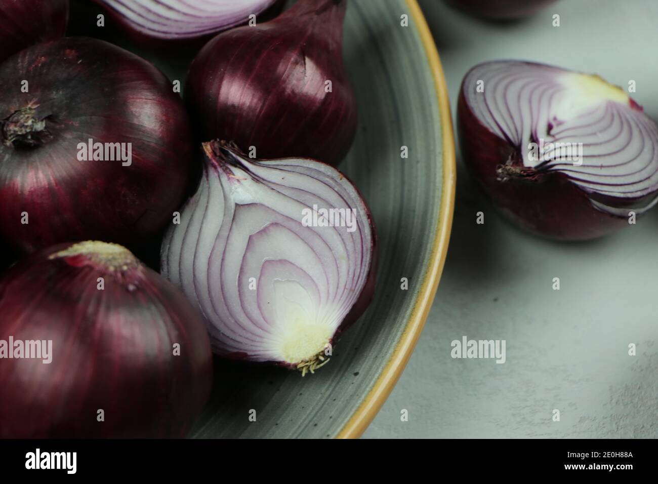 sweet red onions on background Stock Photo - Alamy