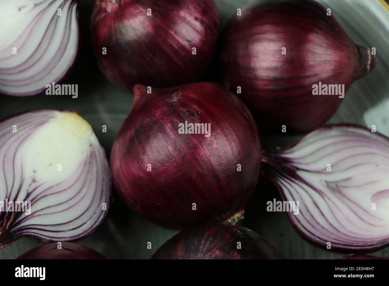 sweet red onions on background Stock Photo - Alamy