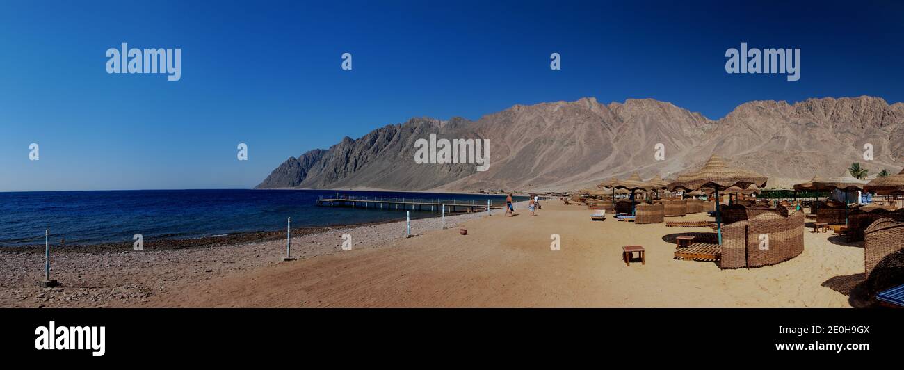 blue sea with jetty and sandy beach in dahab egypt panorama Stock Photo ...