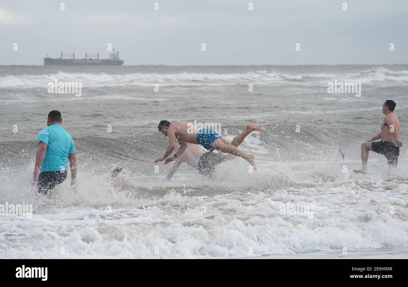 People take a dip into the sea at Whitley Bay Stock Photo - Alamy
