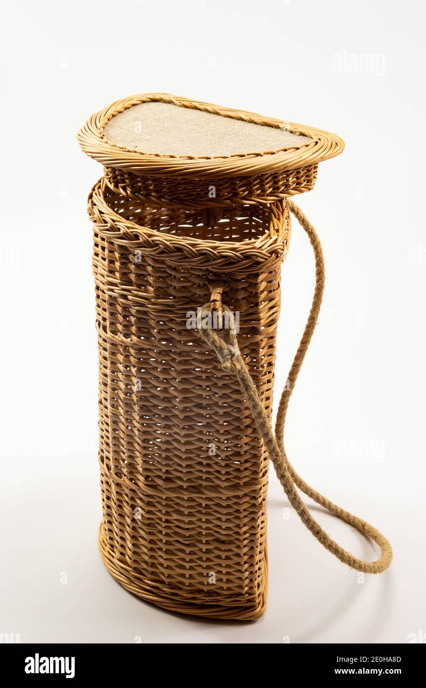 Wicker basket made by the master is placed on the wall, good work Stock ...