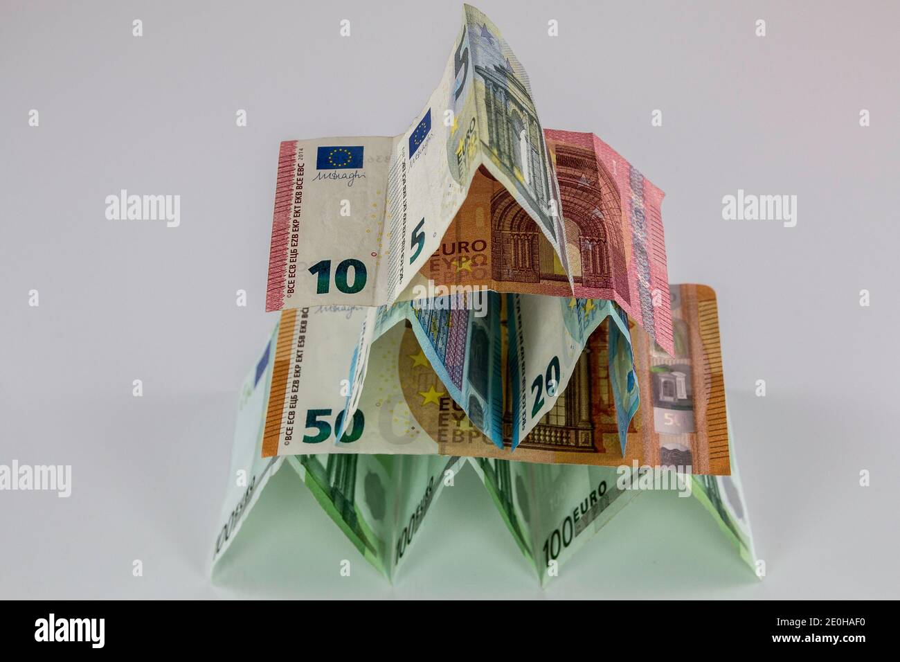 A tiny building made of different Euro banknotes Stock Photo - Alamy