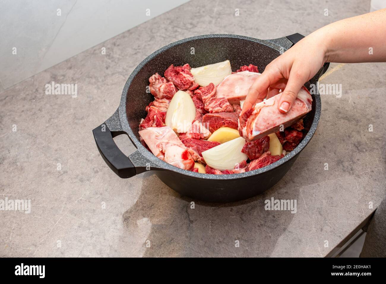 Potatoes added dish cooking potato hi-res stock photography and images ...