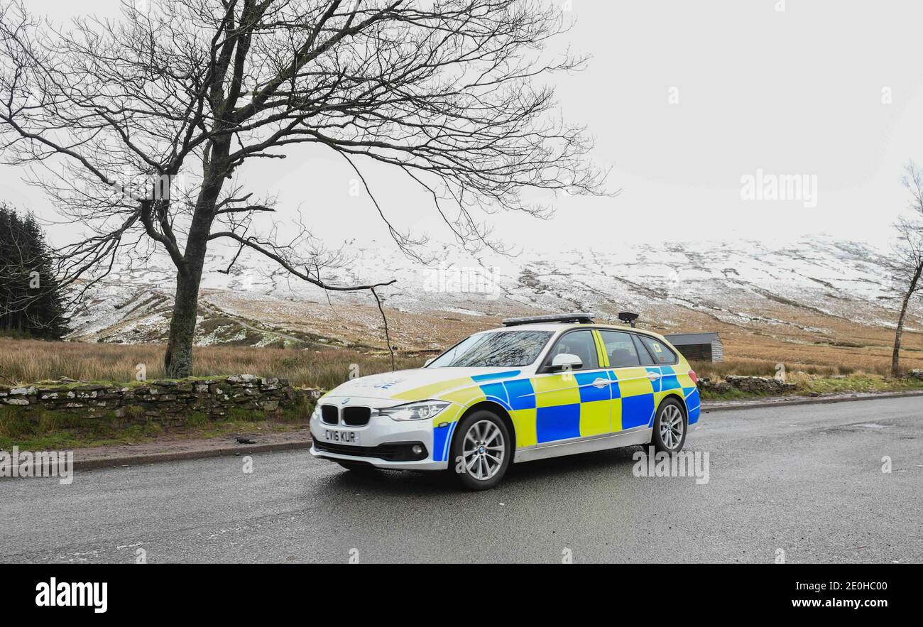 Pen y Fan, Brecon Beacons, Wales. 30th December 2020. Police patrol the ...