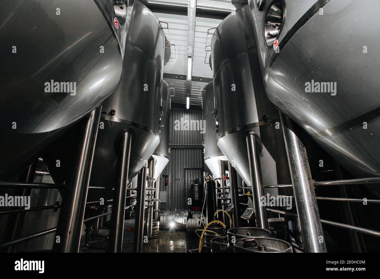 The interior of the brewery. Modern beer factory. Rows of steel ...