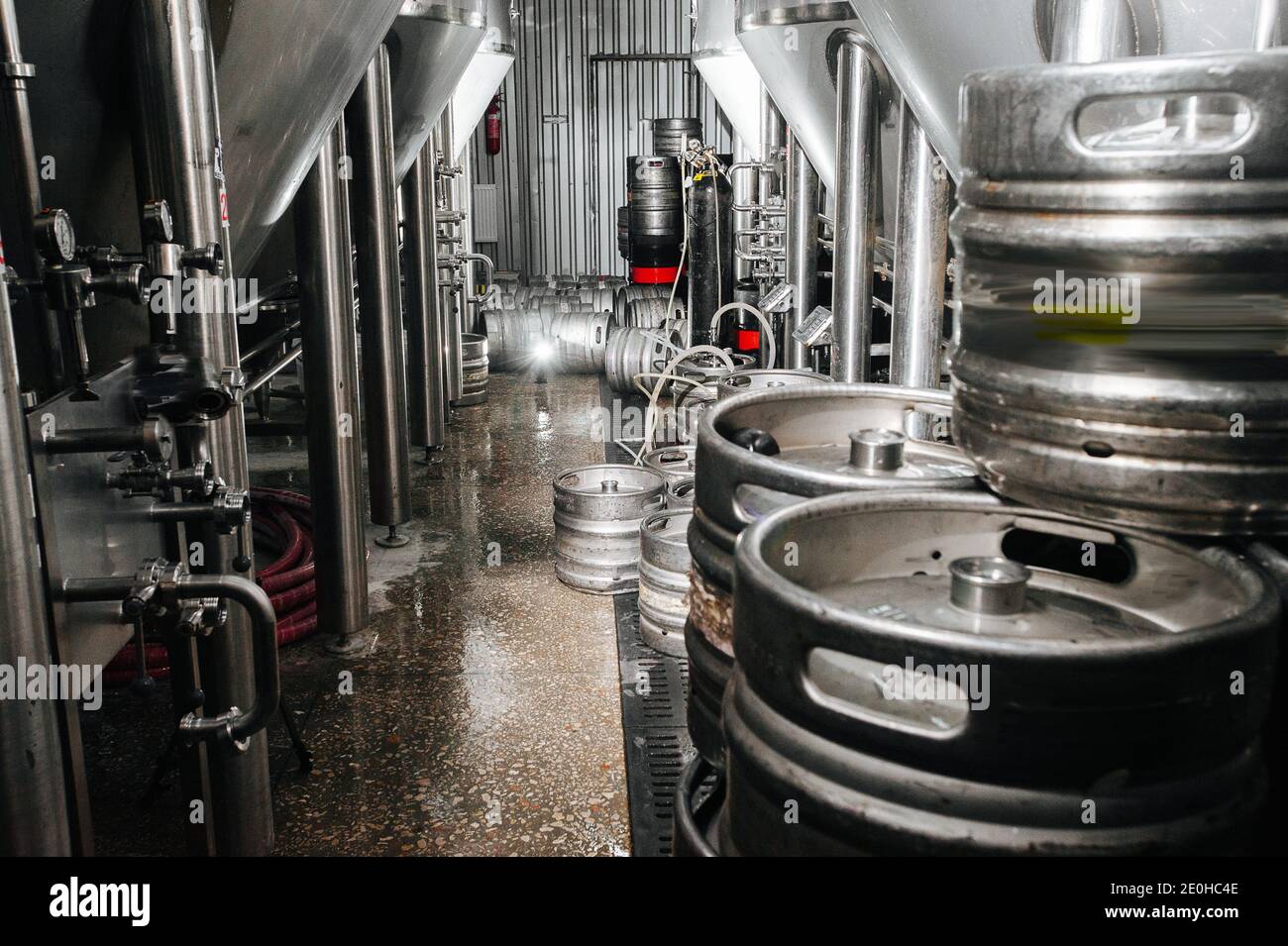 The interior of the brewery. Modern beer factory. Rows of steel ...