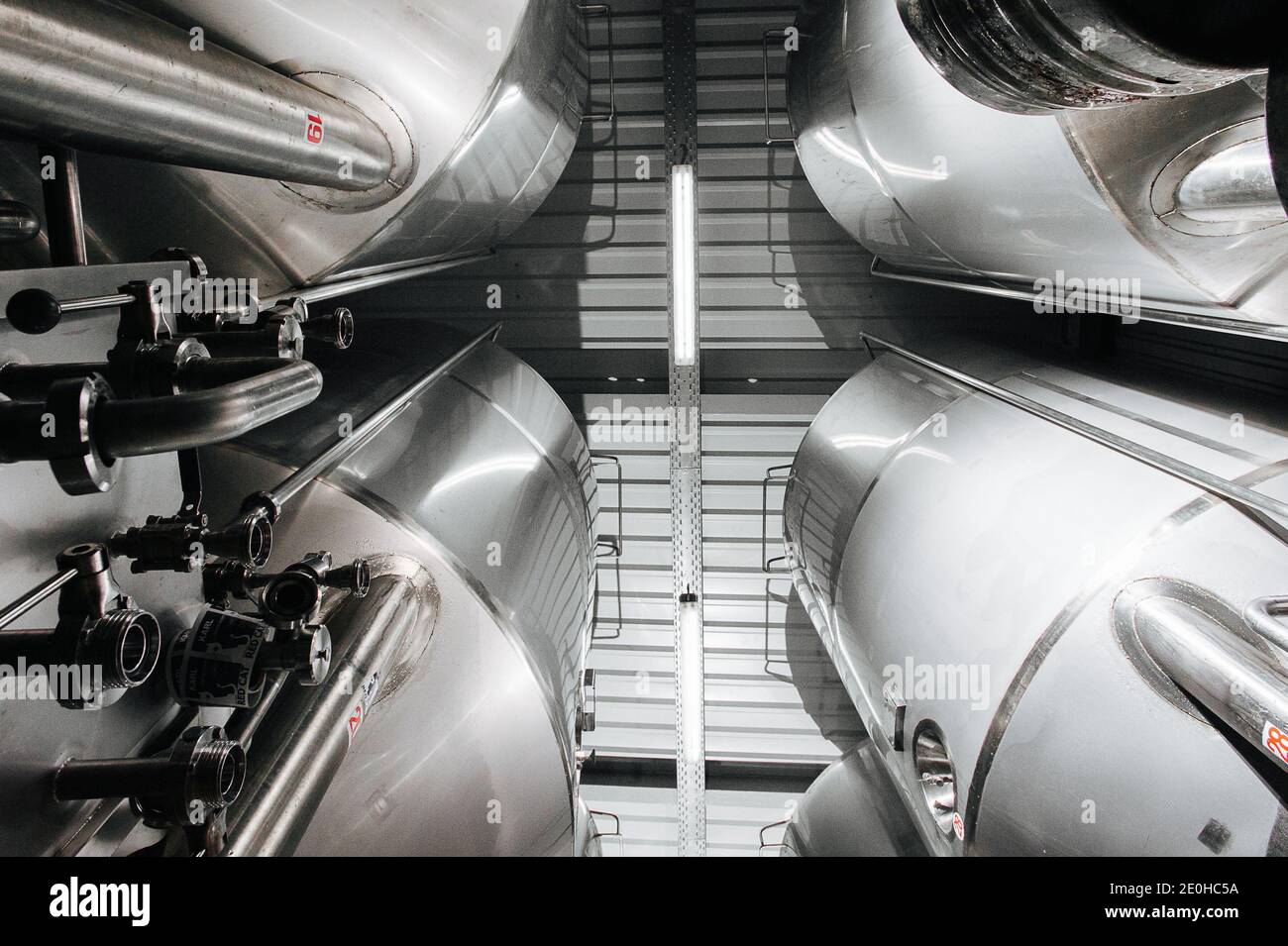 The interior of the brewery. Modern beer factory. Rows of steel ...