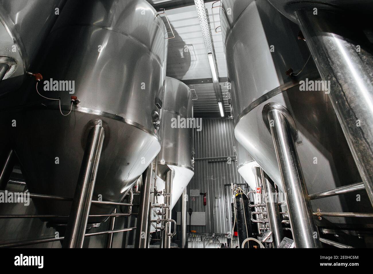 The interior of the brewery. Modern beer factory. Rows of steel ...