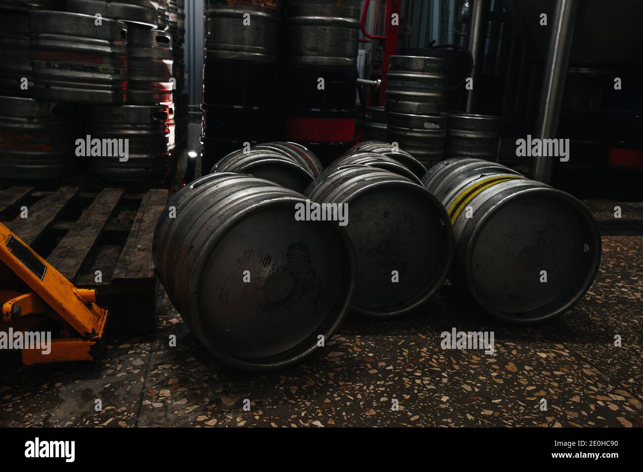 Steel industrial stack of beer kegs against. Modern brewery and ...