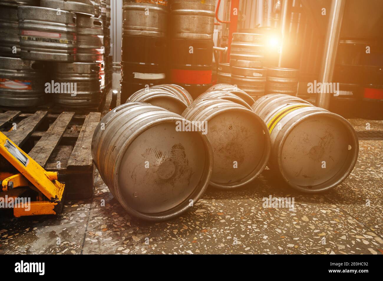 Steel industrial stack of beer kegs against. Modern brewery and ...