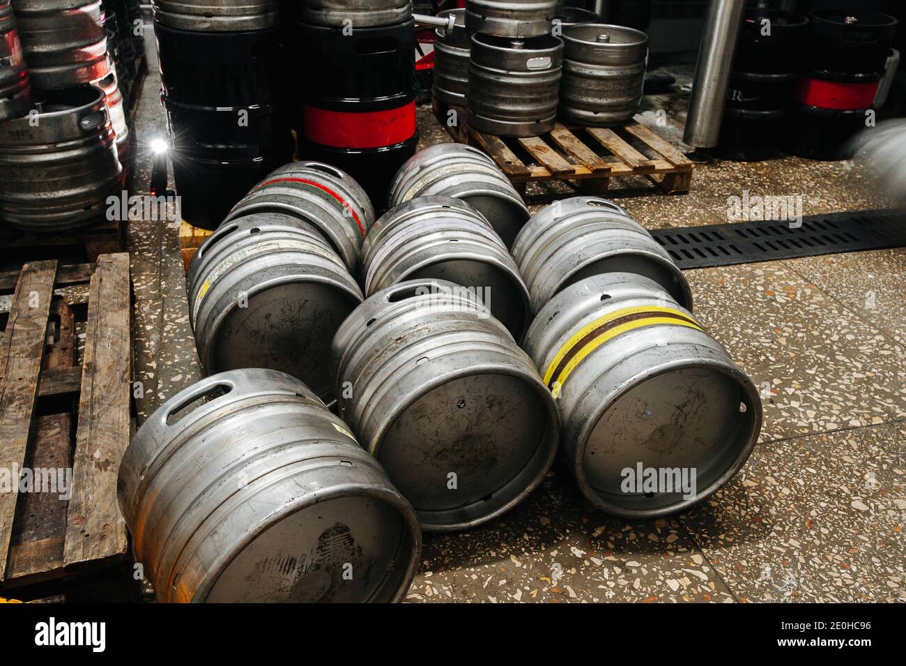 Steel industrial stack of beer kegs against. Modern brewery and ...