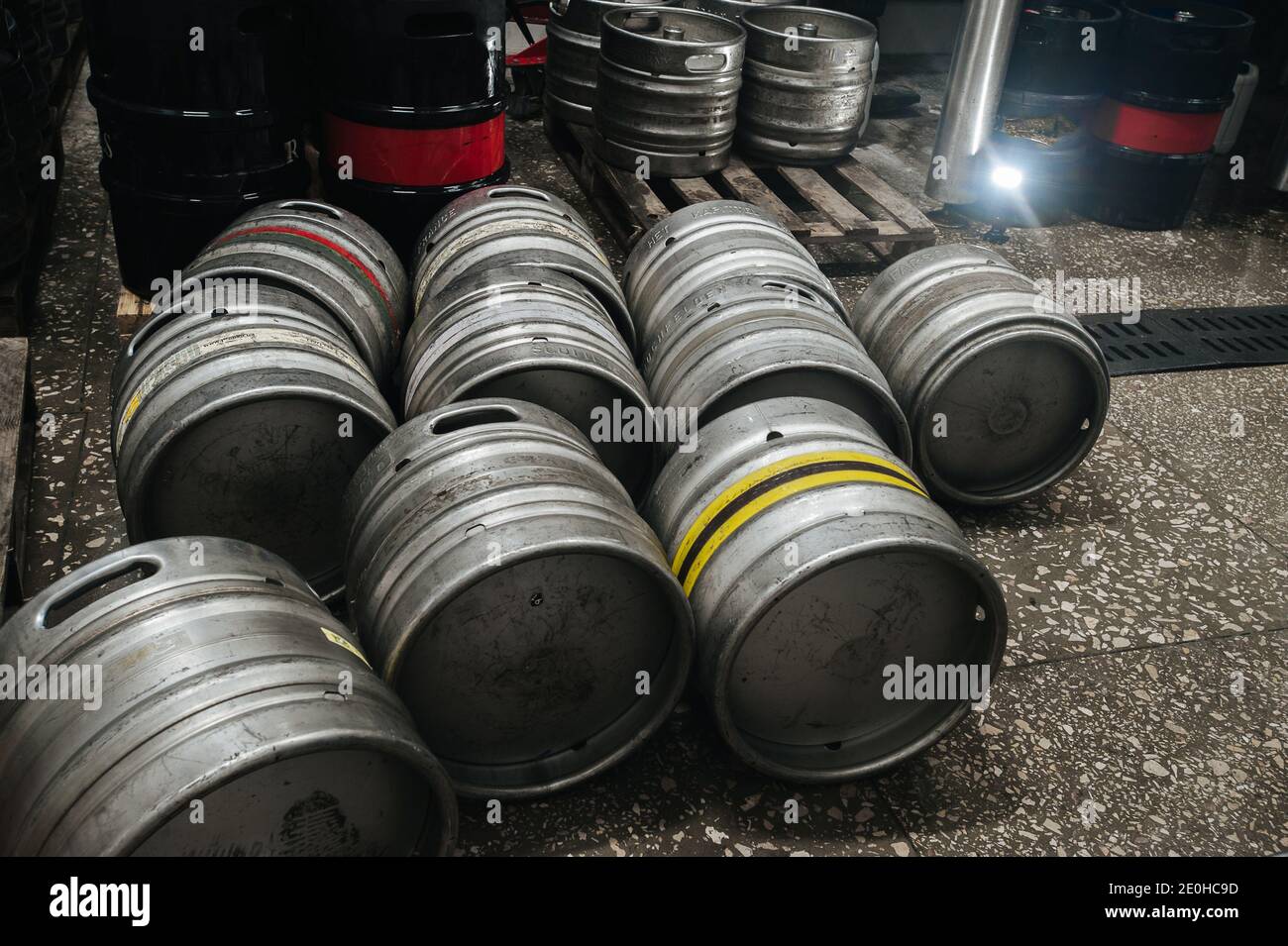 Steel industrial stack of beer kegs against. Modern brewery and ...