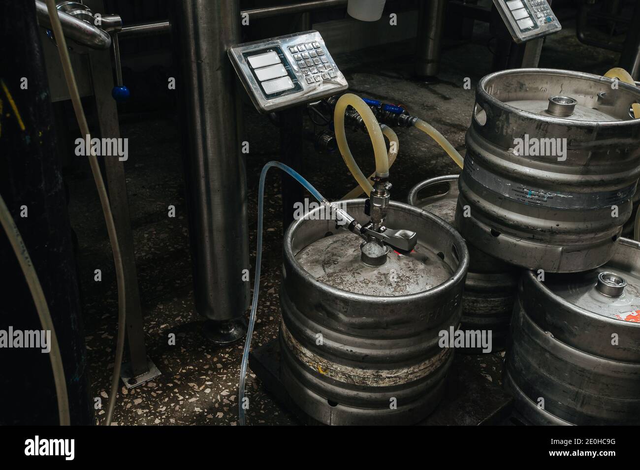 Steel industrial stack of beer kegs against. Modern brewery and ...