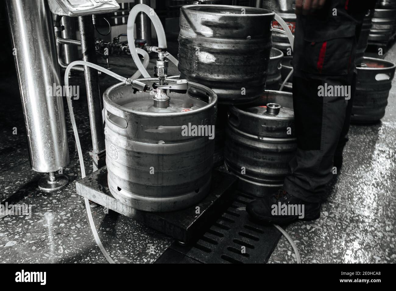 Steel industrial stack of beer kegs against. Modern brewery and ...