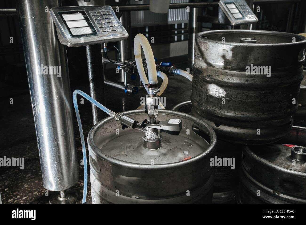 Steel industrial stack of beer kegs against. Modern brewery and ...
