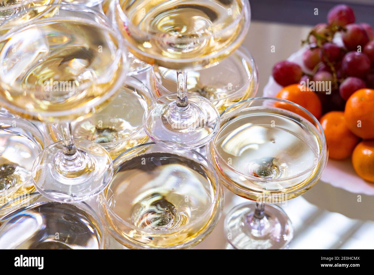 A pyramid of glasses of champagne. White sparkling wine in glasses ...
