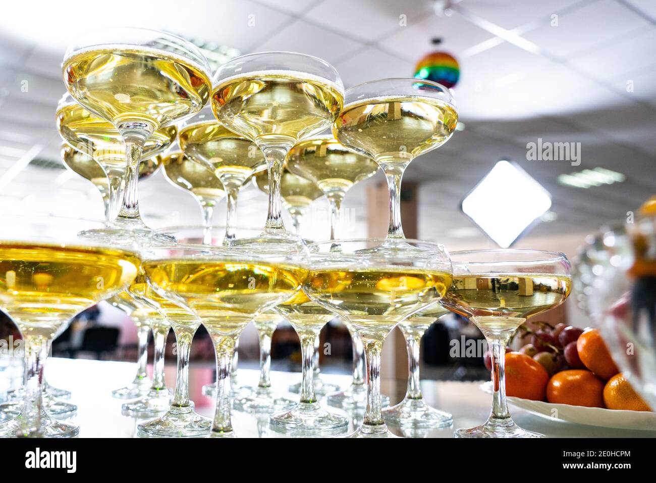 A pyramid of glasses of champagne. White sparkling wine in glasses ...