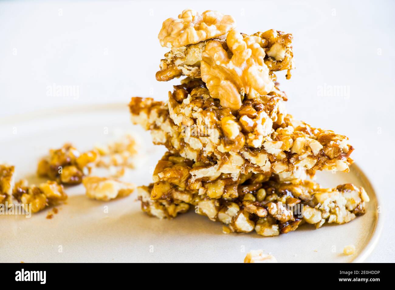 Georgia traditional dessert with nuts and honey, Gozinaki on the plate ...