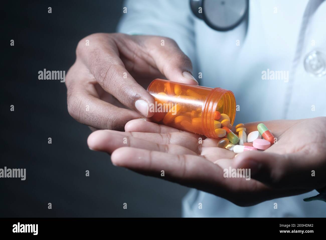Doctor hand holding pill container hi-res stock photography and images ...