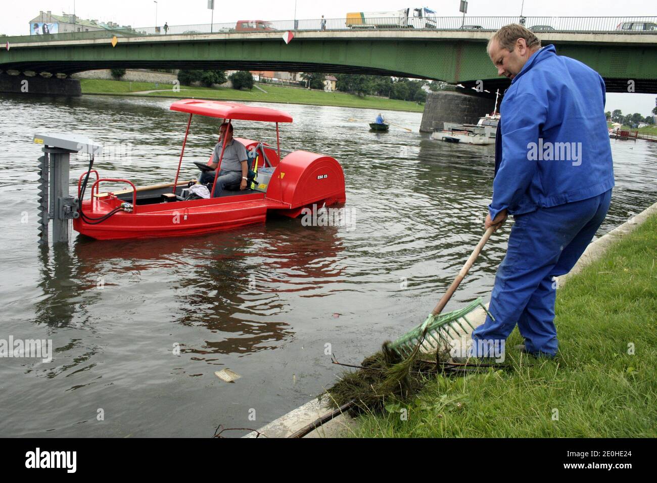 Worker collecting floating garbage hi-res stock photography and images ...
