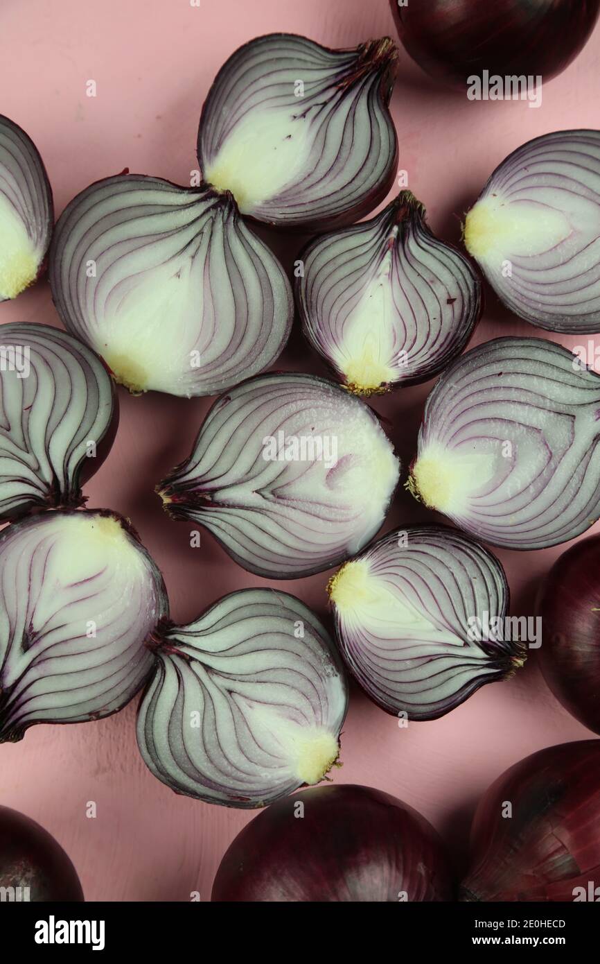 sweet red onions on background Stock Photo - Alamy