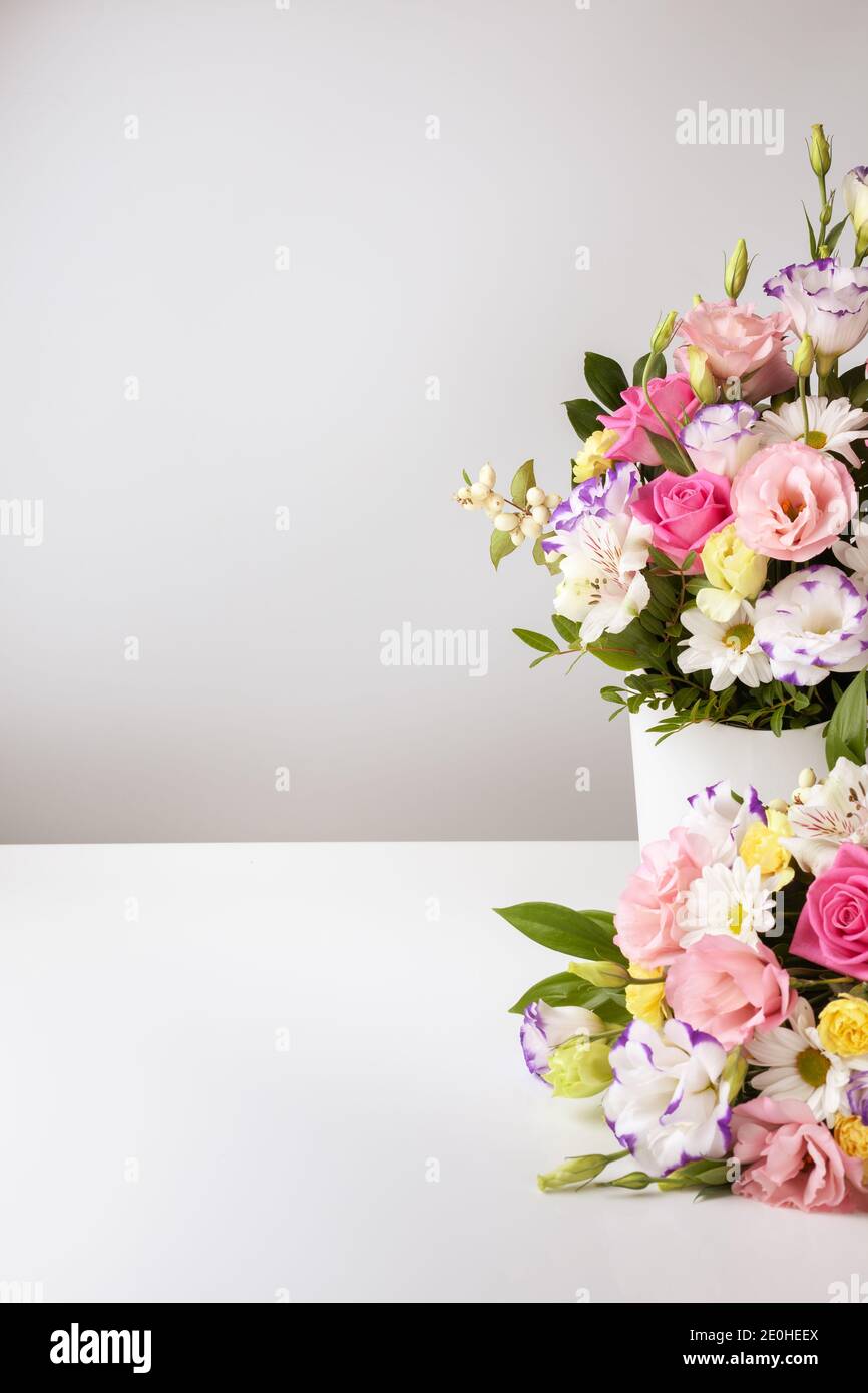 mock up two bouquets of different sizes of roses, daisies, lisianthus ...