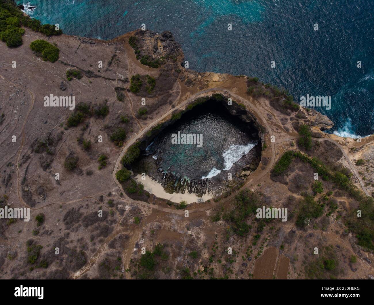 Aerial view of Pasih Uug Broken beach arch tunnel cliff cove natural ...