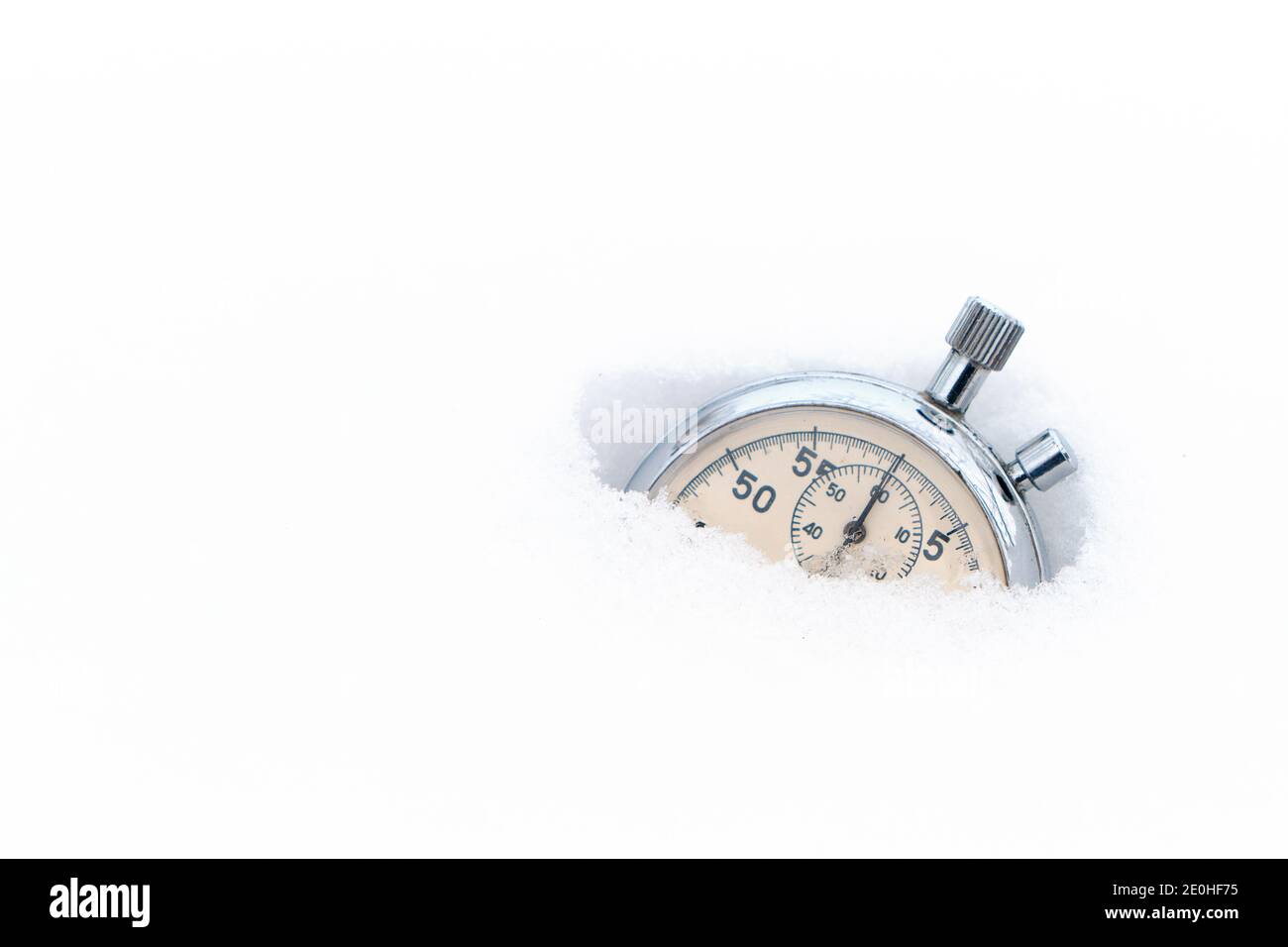 Fallen in the snow, in winter, stopwatch on a white background Stock ...