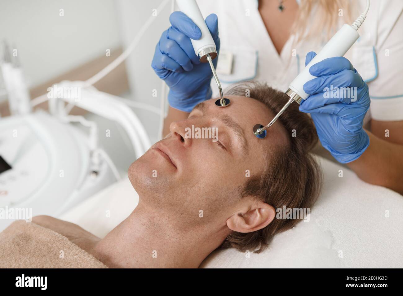 Close up of a male client getting electrolysis facial skincare ...
