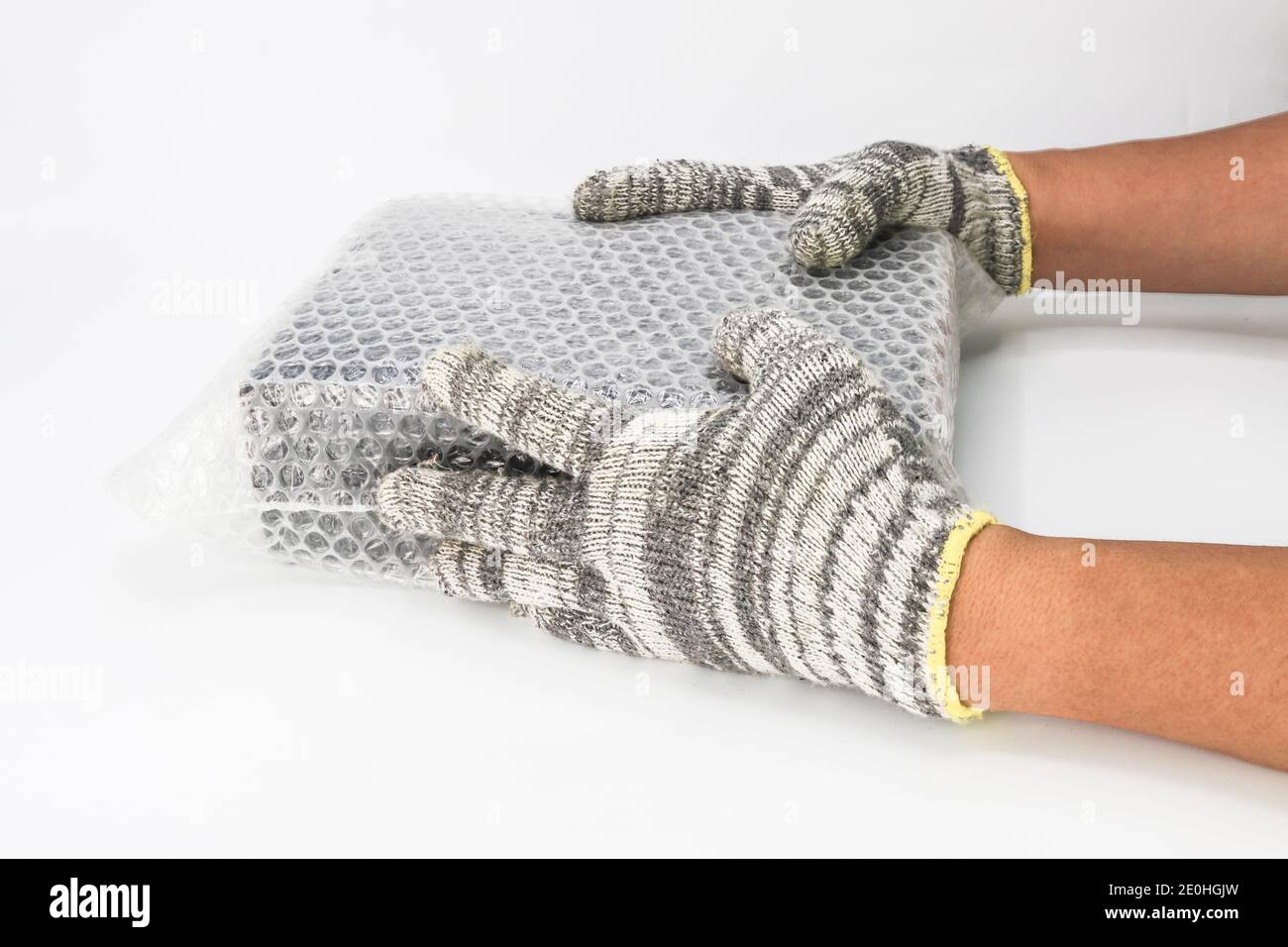 hand of man hold bubble wrap, for protection parcel product cracked or ...