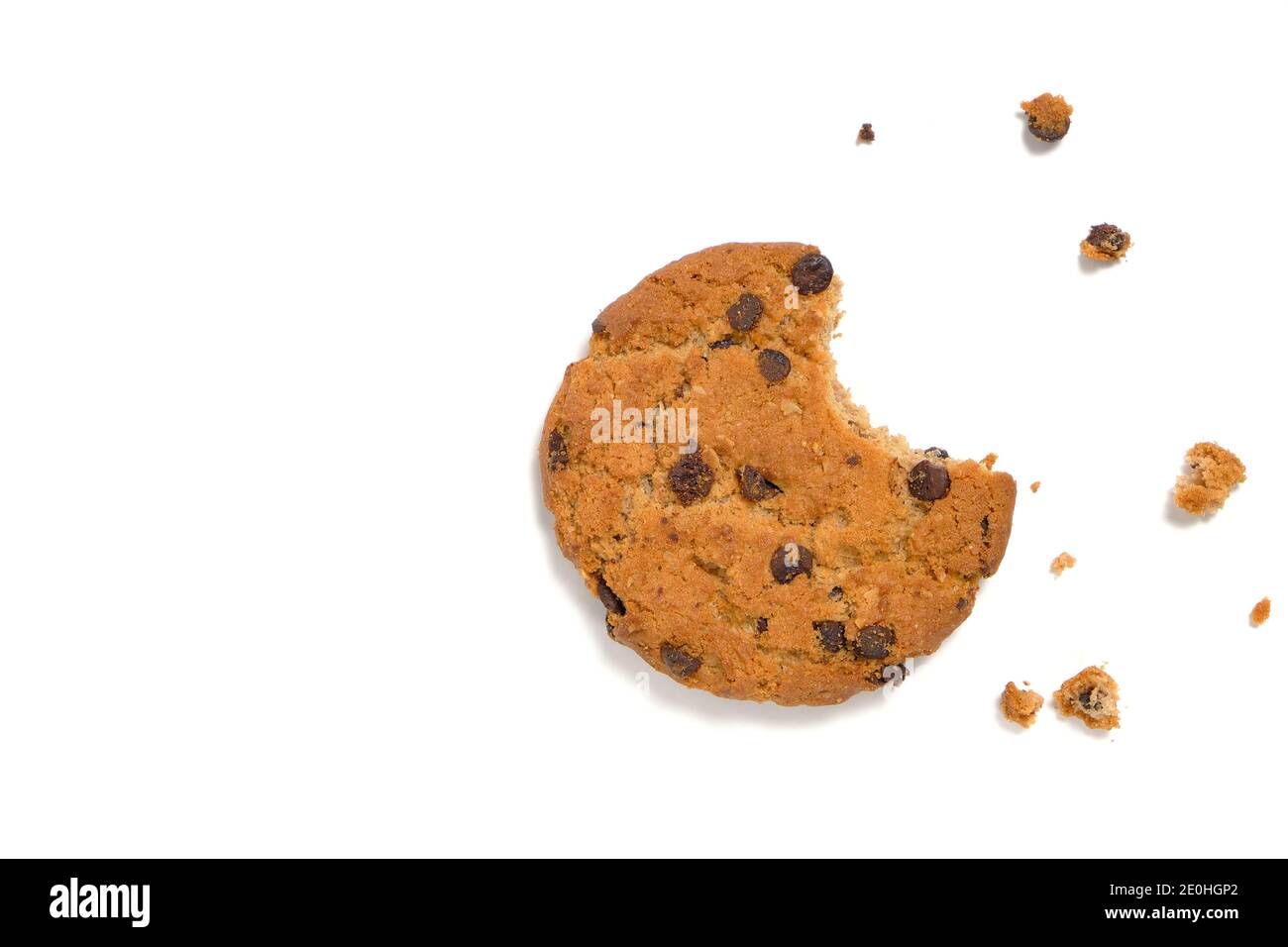 Bitten off chocolate, crumbled homemade cookies on a white background ...