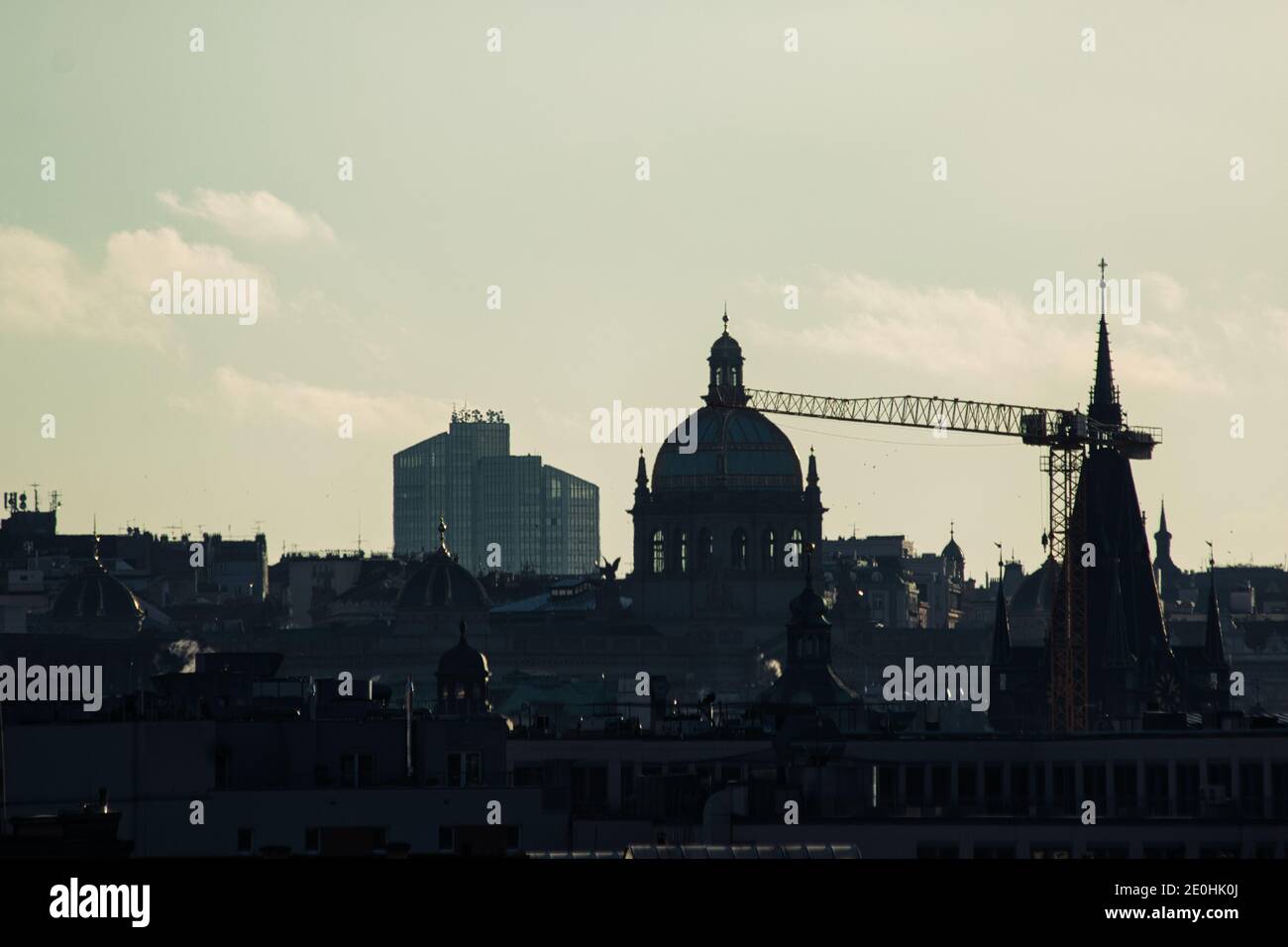 backlit Prague skyline buildings siwh smoke chimneys silhouette Stock ...