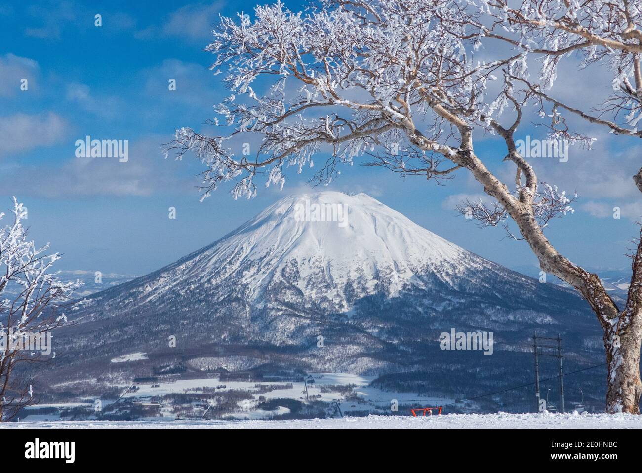 Mount Yotei, an active volcano on a sunny winter day in Niseko ...