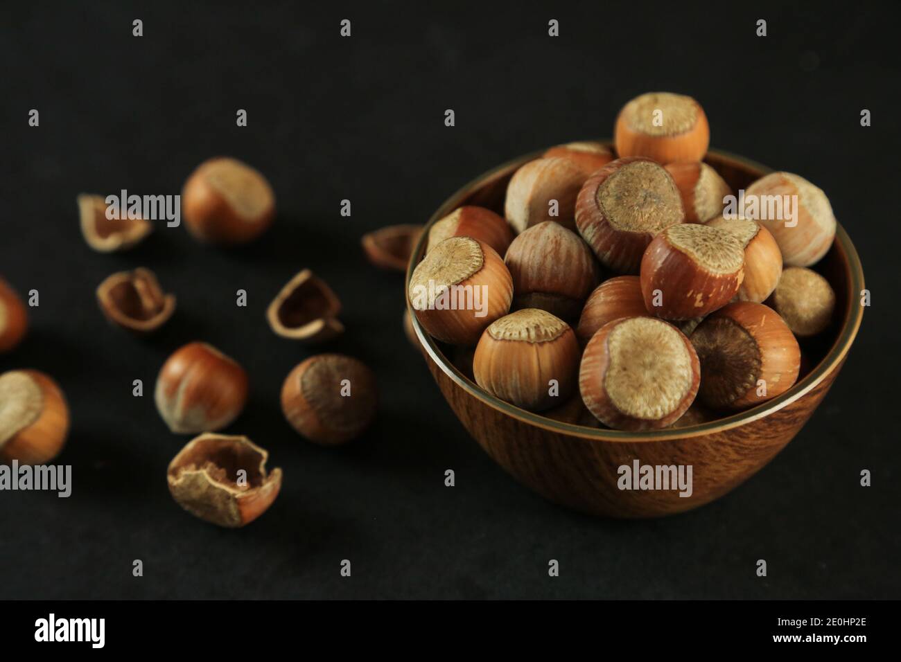 Hazelnuts on wooden backdrop. heap or stack of hazelnuts. healty food ...