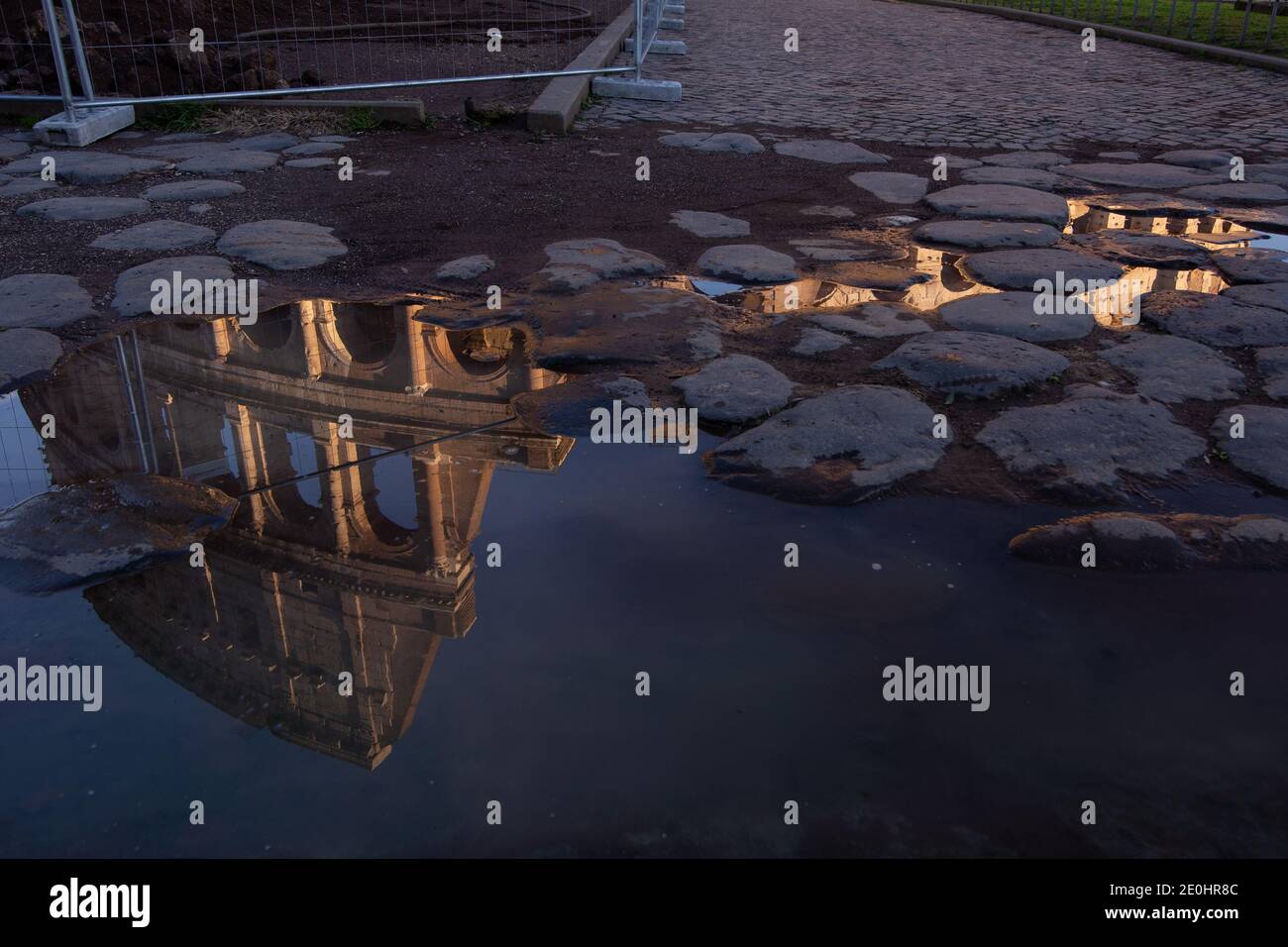 Rome, Italy. 31st Dec, 2020. View of the Colosseum reflected in a ...