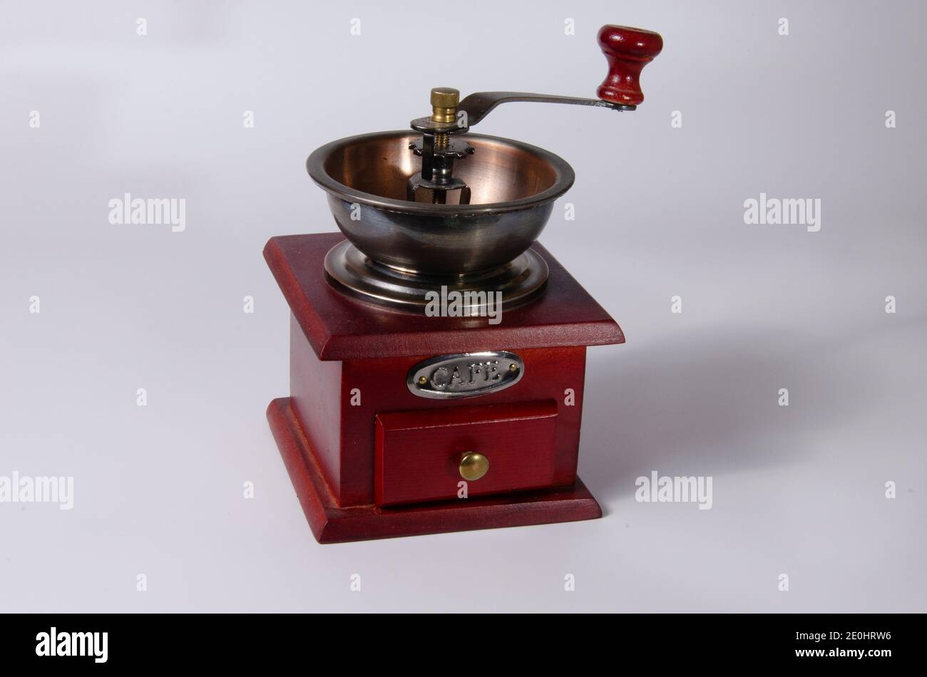 Red coffee grinder in vintage style on a white background Stock Photo ...