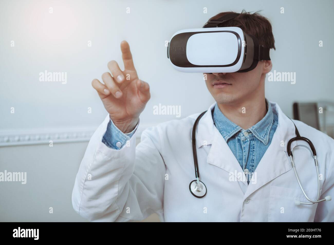Close up of a male doctor wearing 3d vr glasses. Experienced male ...