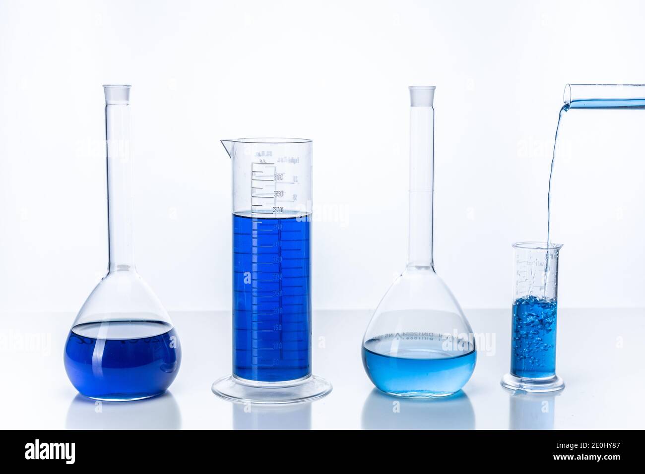 Test tube and flask with blue liquid. Chemistry and laboratory concept ...