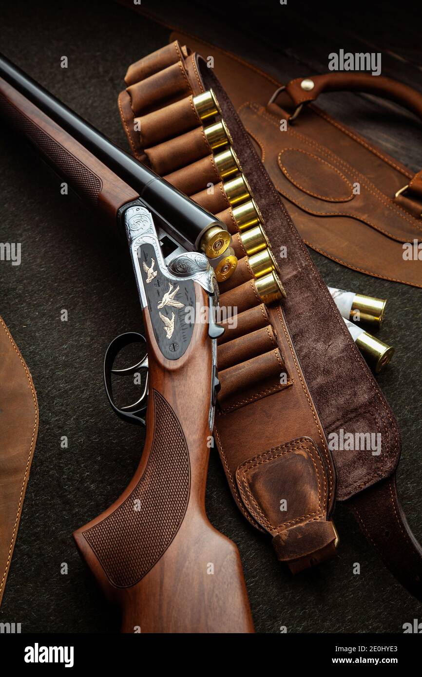 Classic trigger double-barreled hunting rifle on a green background ...