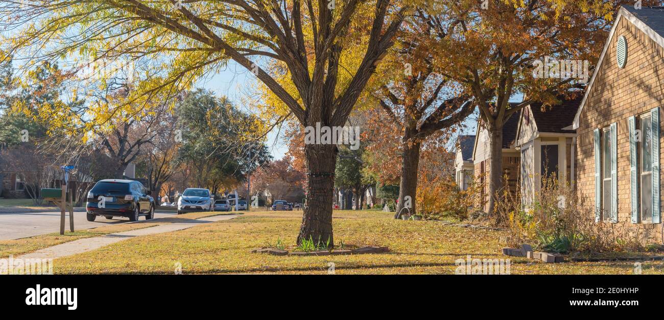Panorama view typical suburban corner house with colorful fall foliage ...