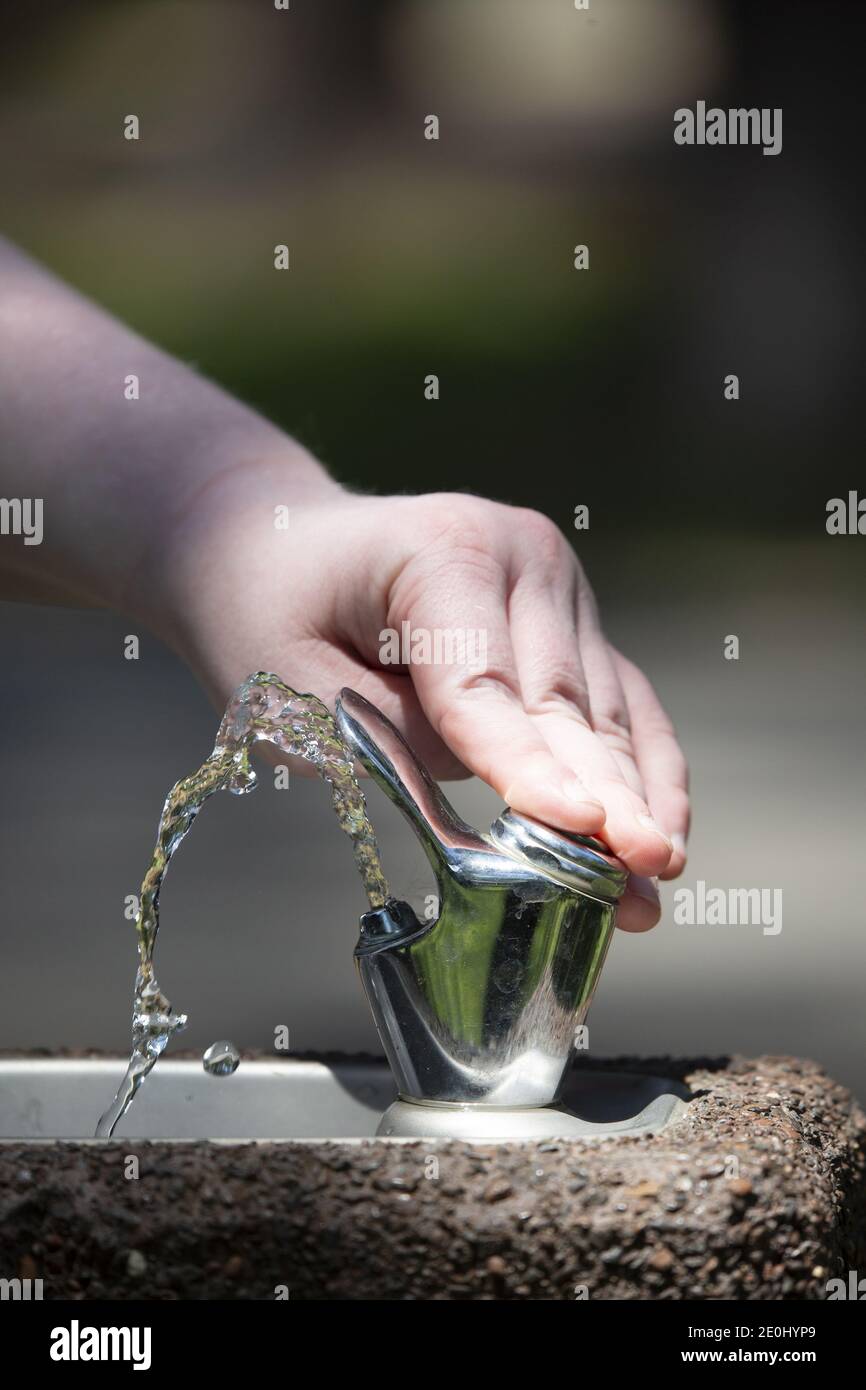 Water from an outdoor water fountain spurting up Stock Photo - Alamy