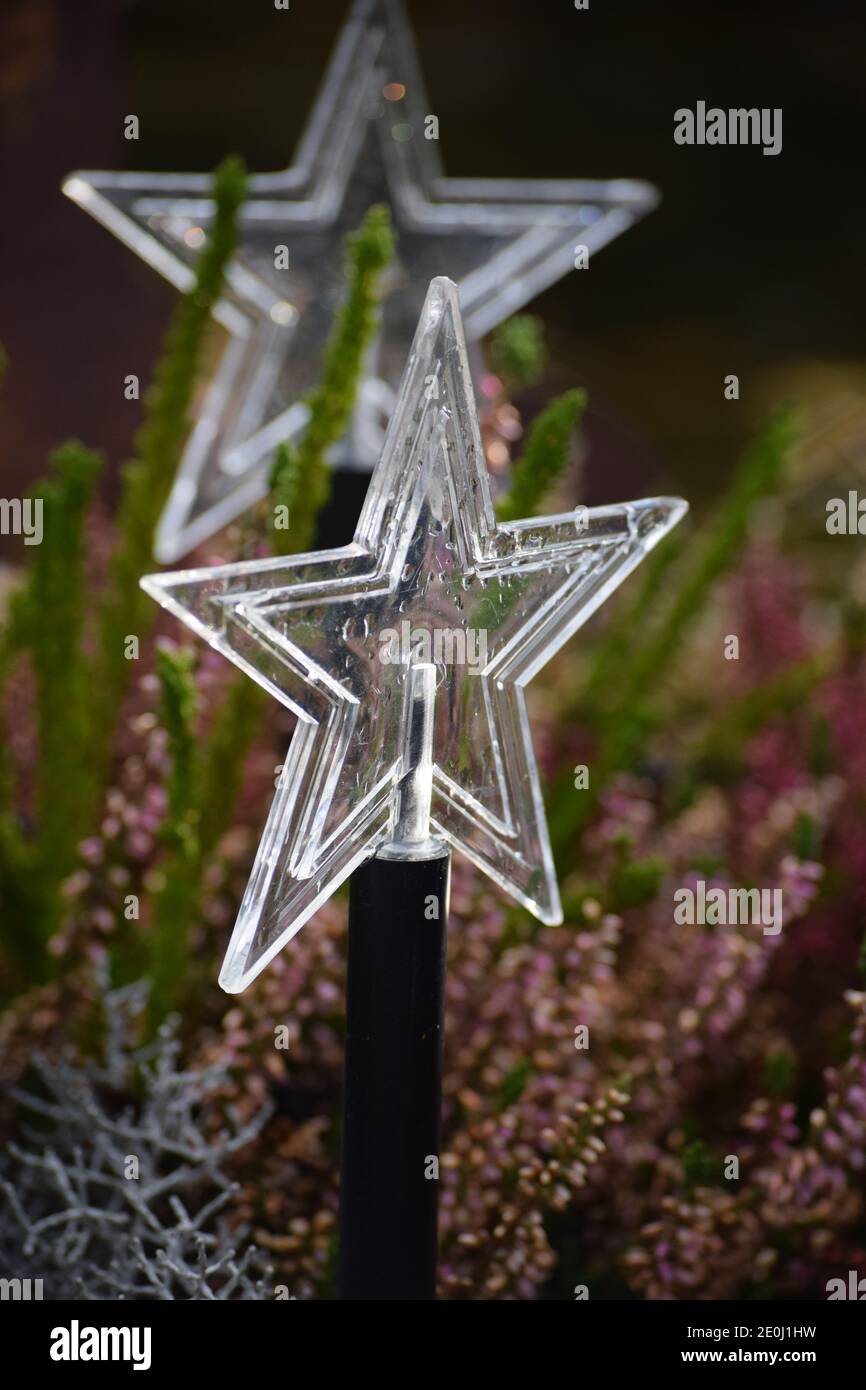 two illuminated Plastic-stars as Ground spikes Stock Photo - Alamy