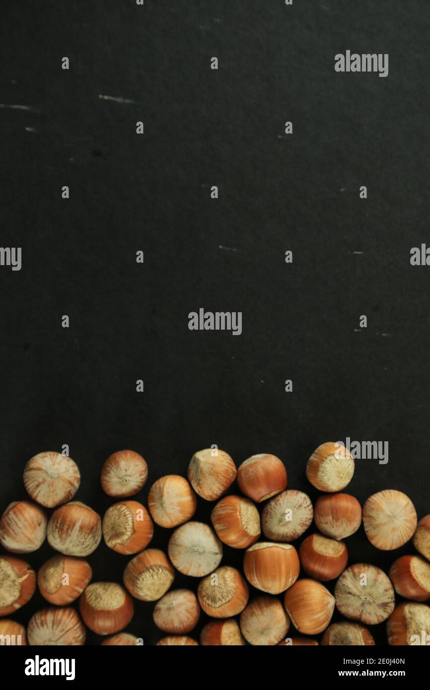 Hazelnuts on wooden backdrop. heap or stack of hazelnuts. healty food ...