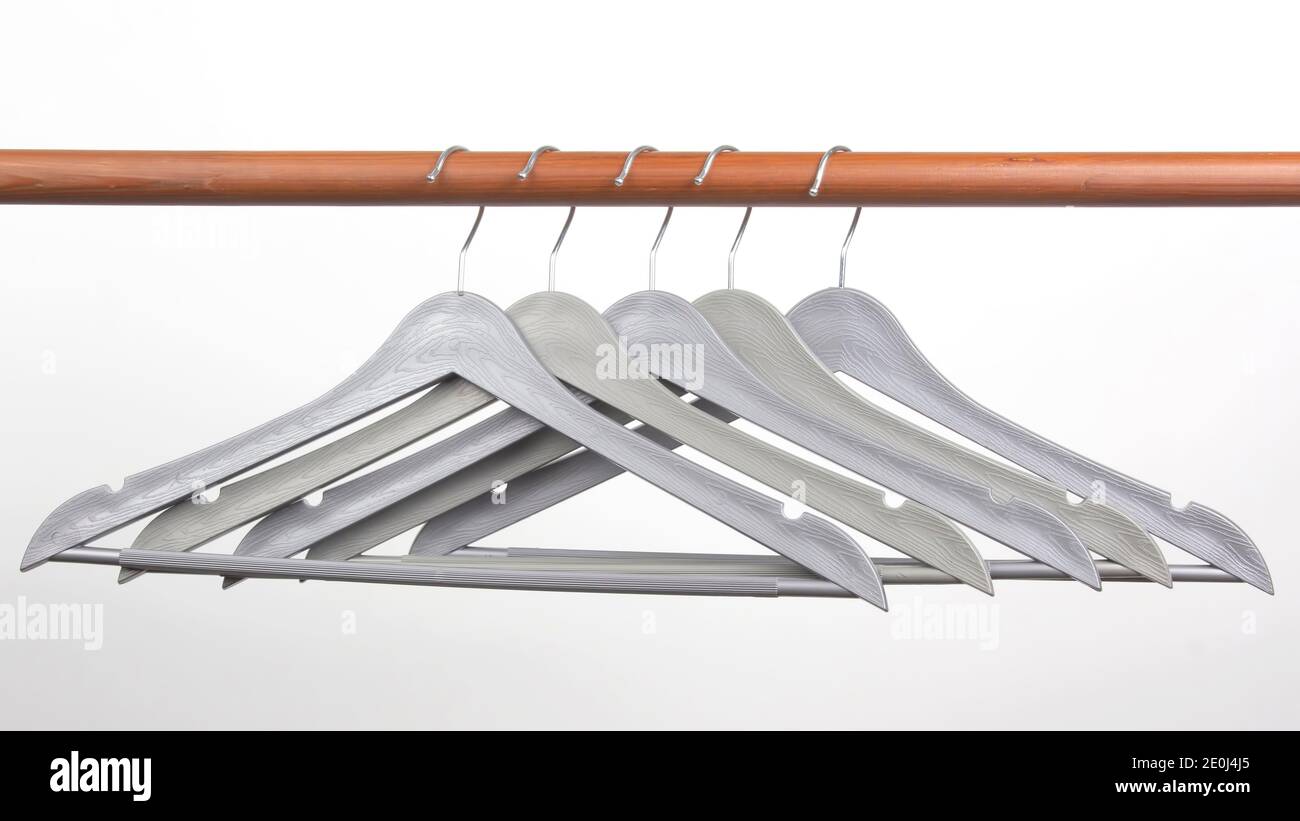 Set of gray clothes hangers on a white background Stock Photo - Alamy