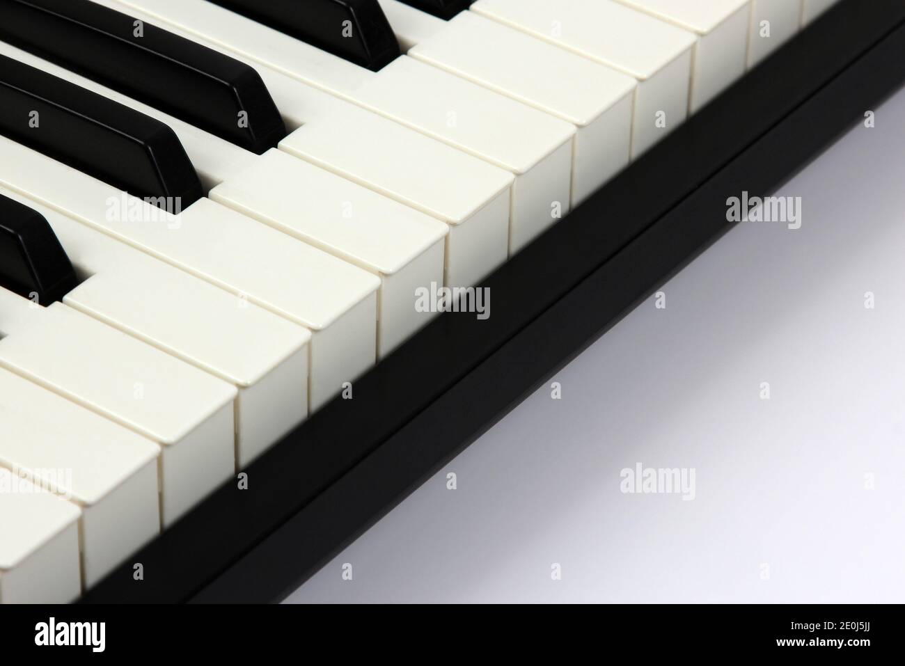 the piano keys closeup on white background Stock Photo - Alamy